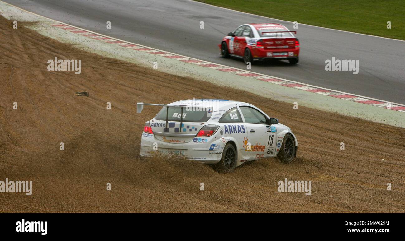 Martyn Bell spins into the gravel at Paddock Hill bend on a wet track ...