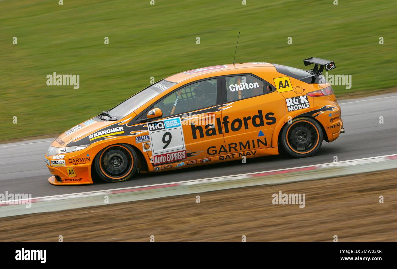 Tom Chilton on a wet track at Brands Hatch driving the Honda Civic ...
