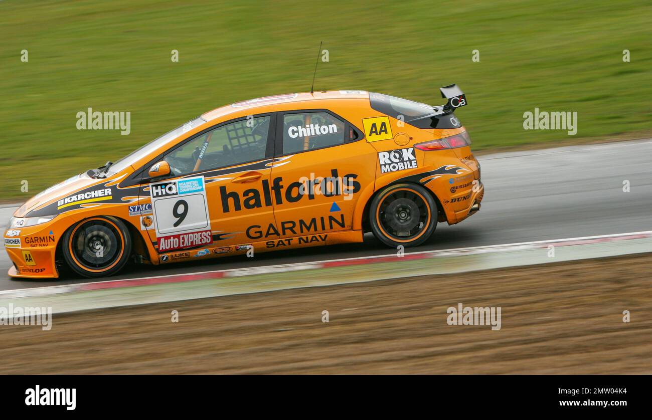 Tom Chilton on a wet track at Brands Hatch driving the Honda Civic ...
