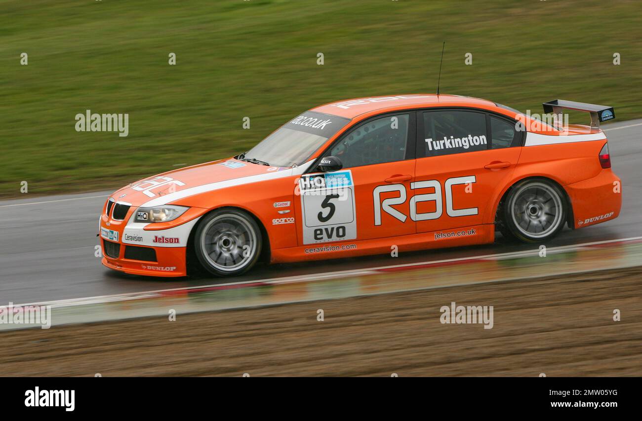 Colin Turkington on a wet track at Brands Hatch driving the orange Team ...