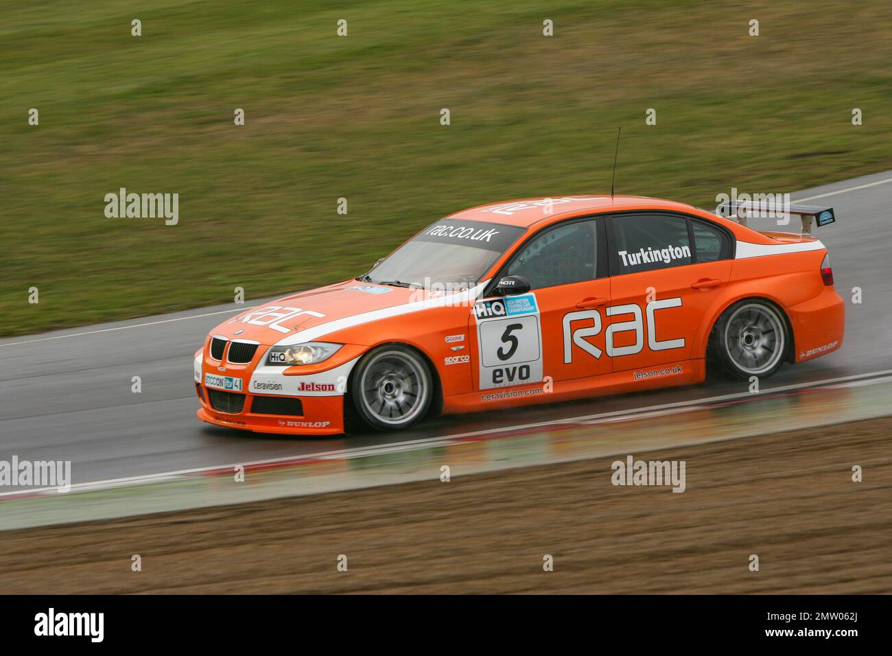 Colin Turkington on a wet track at Brands Hatch driving the orange Team ...