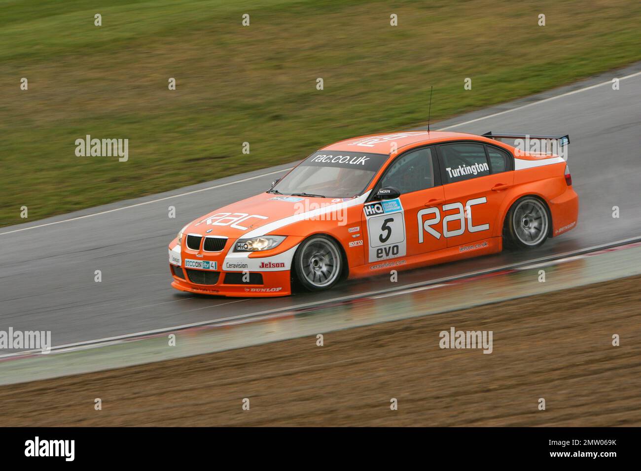 Colin Turkington on a wet track at Brands Hatch driving the orange Team ...