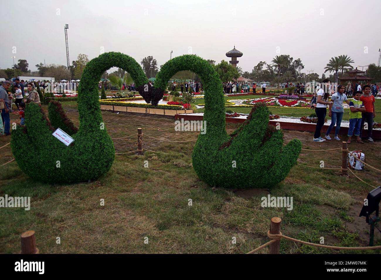 Iraqis attend a flower festival at al-Zawra Park in Baghdad, Iraq ...