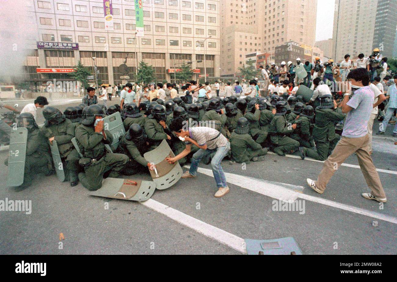 Demonstrating students seize weapons and other gear from riot police ...