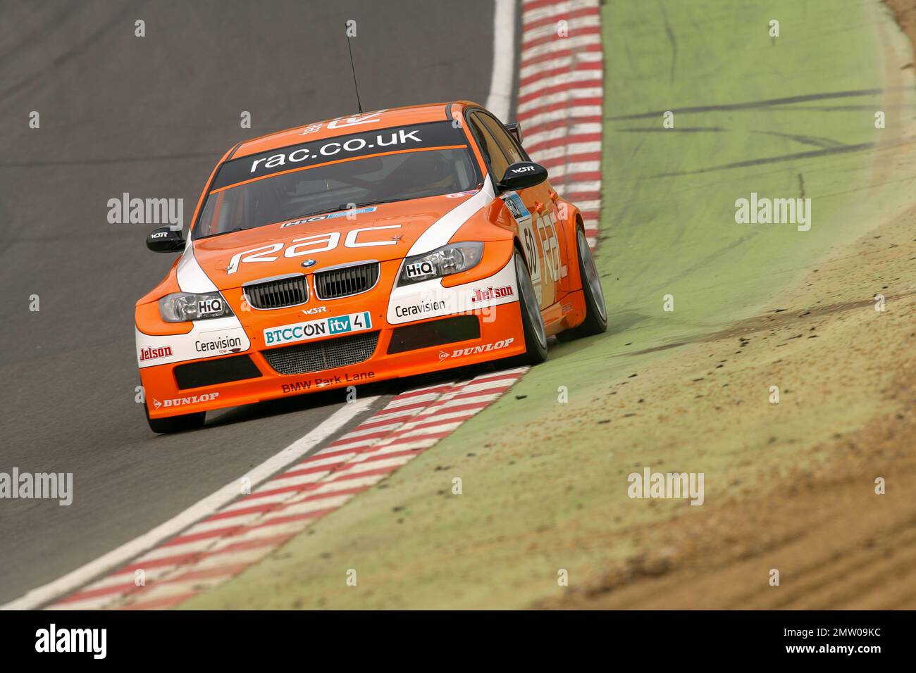 Stephen Jelley on Brands Hatch driving the orange Team RAC BMW during ...