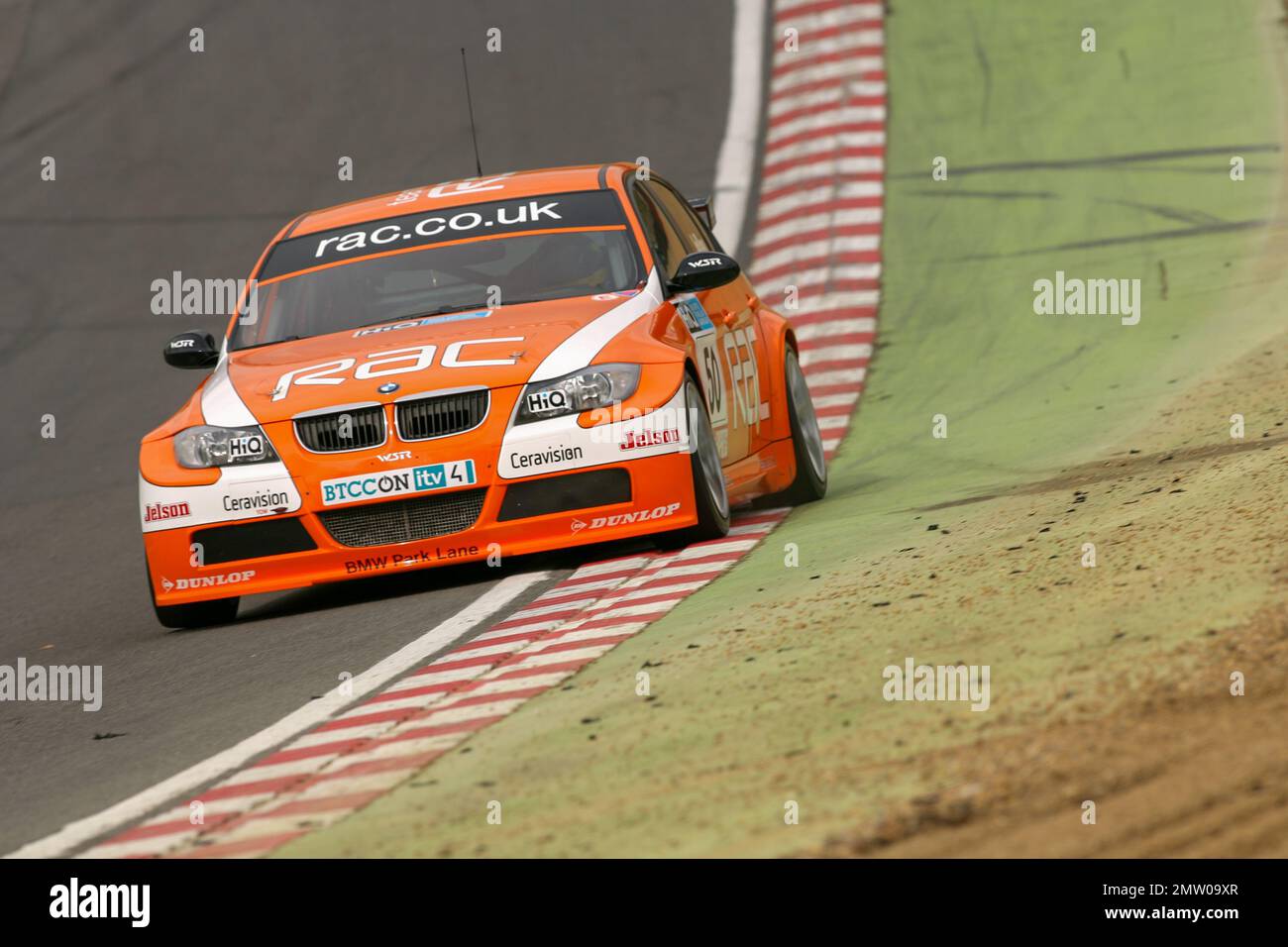 Stephen Jelley on Brands Hatch driving the orange Team RAC BMW during ...