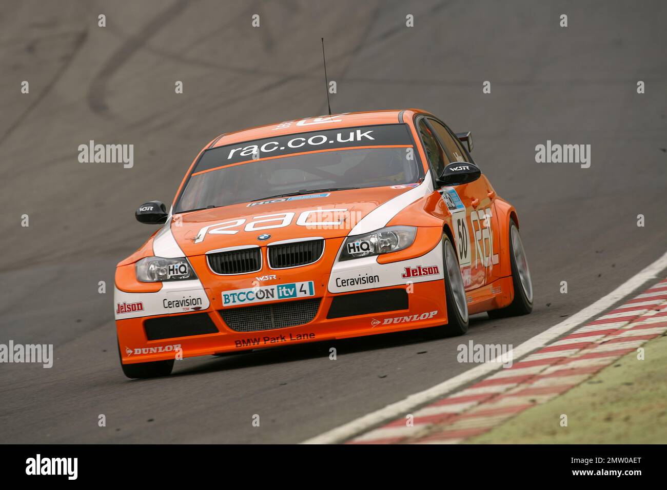 Stephen Jelley on Brands Hatch driving the orange Team RAC BMW during ...
