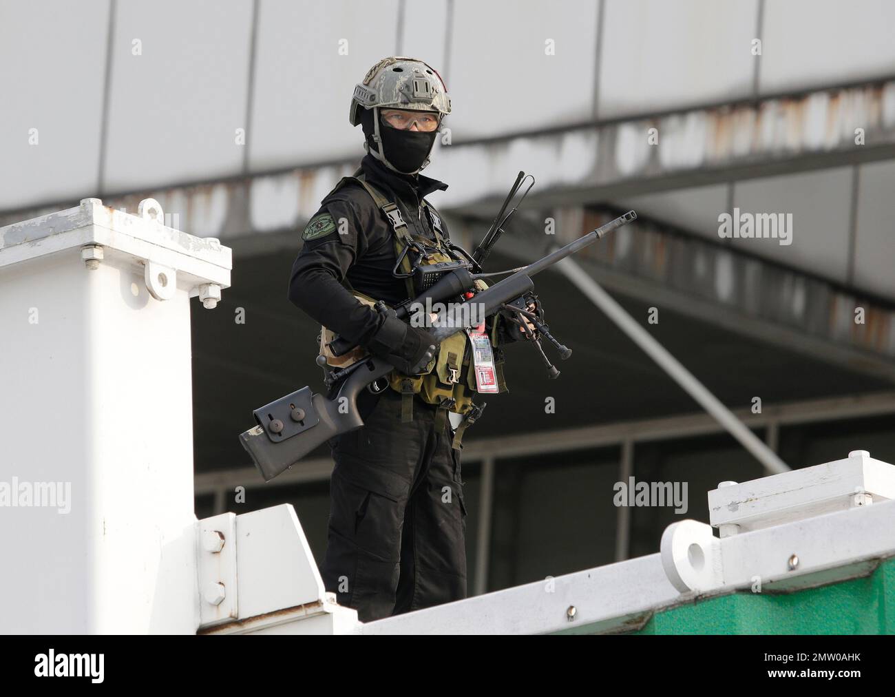 A Filipino sniper from security forces take position ahead of the ...