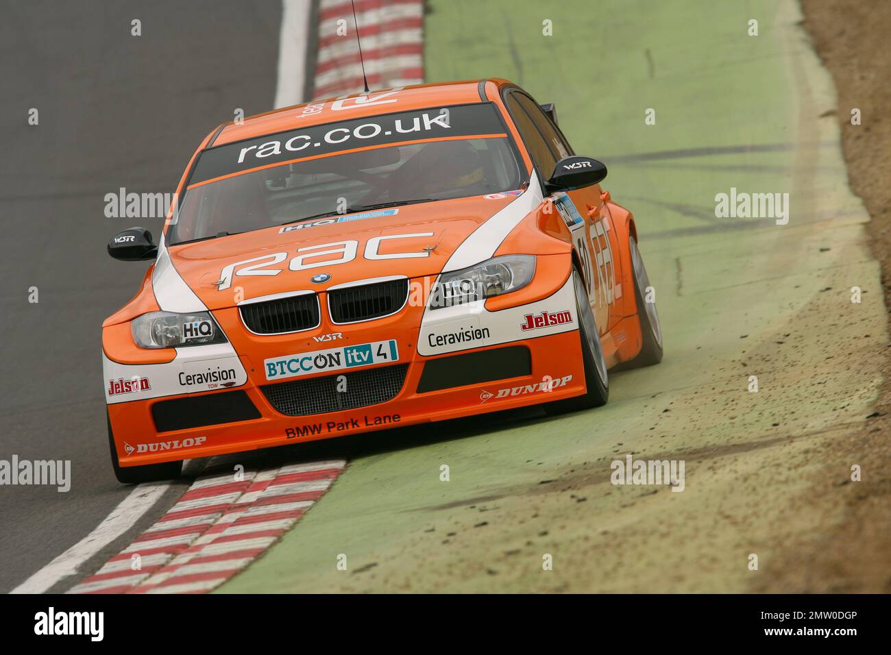Stephen Jelley on Brands Hatch driving the orange Team RAC BMW during ...