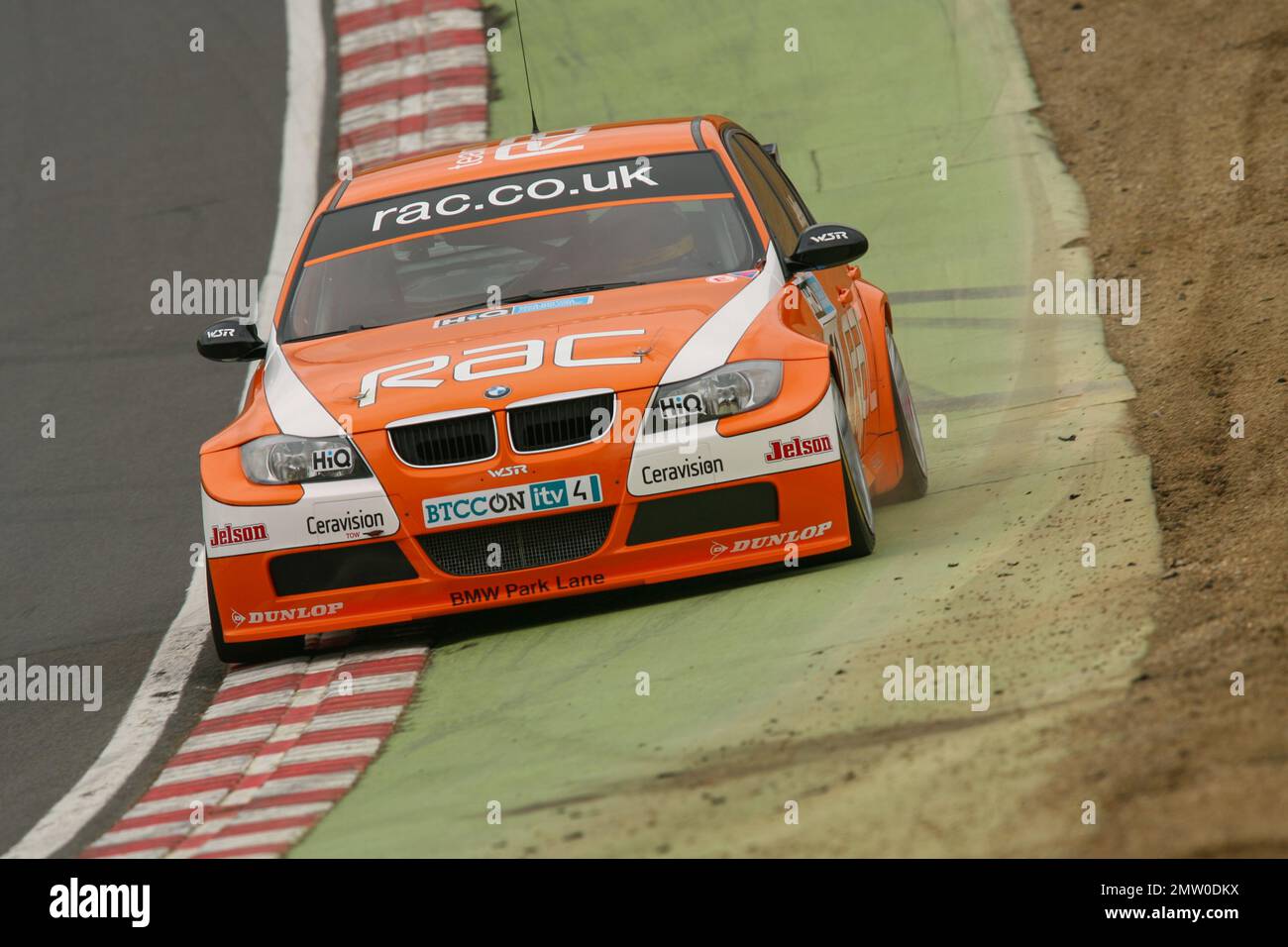 Stephen Jelley on Brands Hatch driving the orange Team RAC BMW during ...