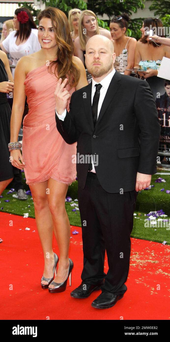 "Twilight" director David Slade and actress Nikki Reed walk the red ...
