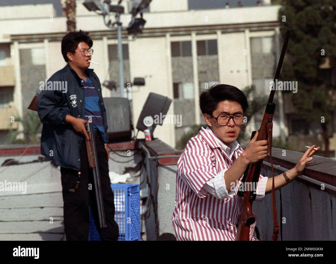 FILE - In this April 30, 1992 file photo, two Korean men stand on the ...