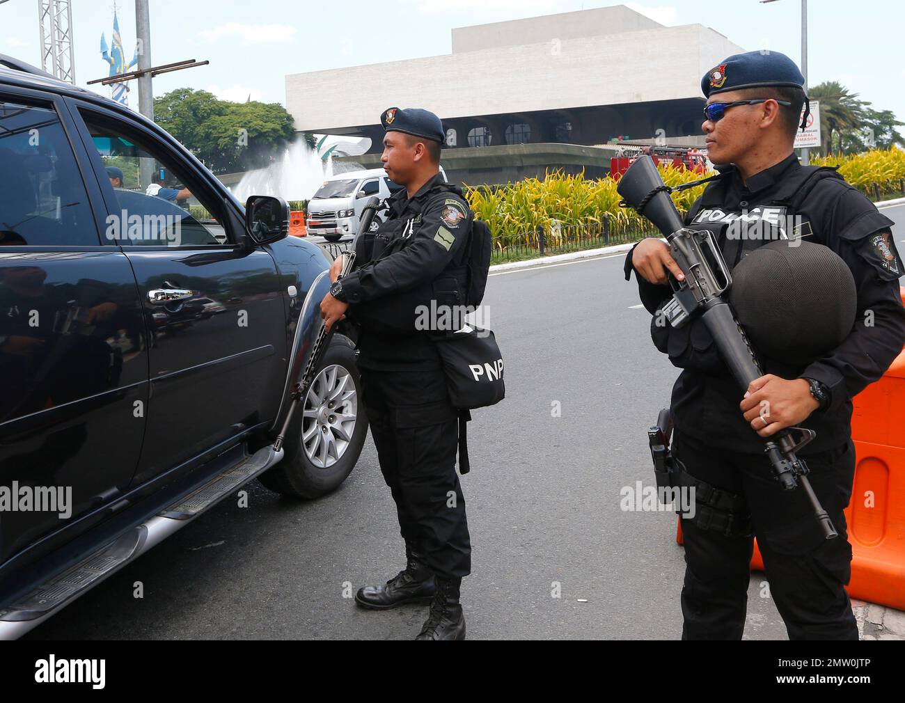 Philippine National Police SWAT officers check vehicles going to the ...
