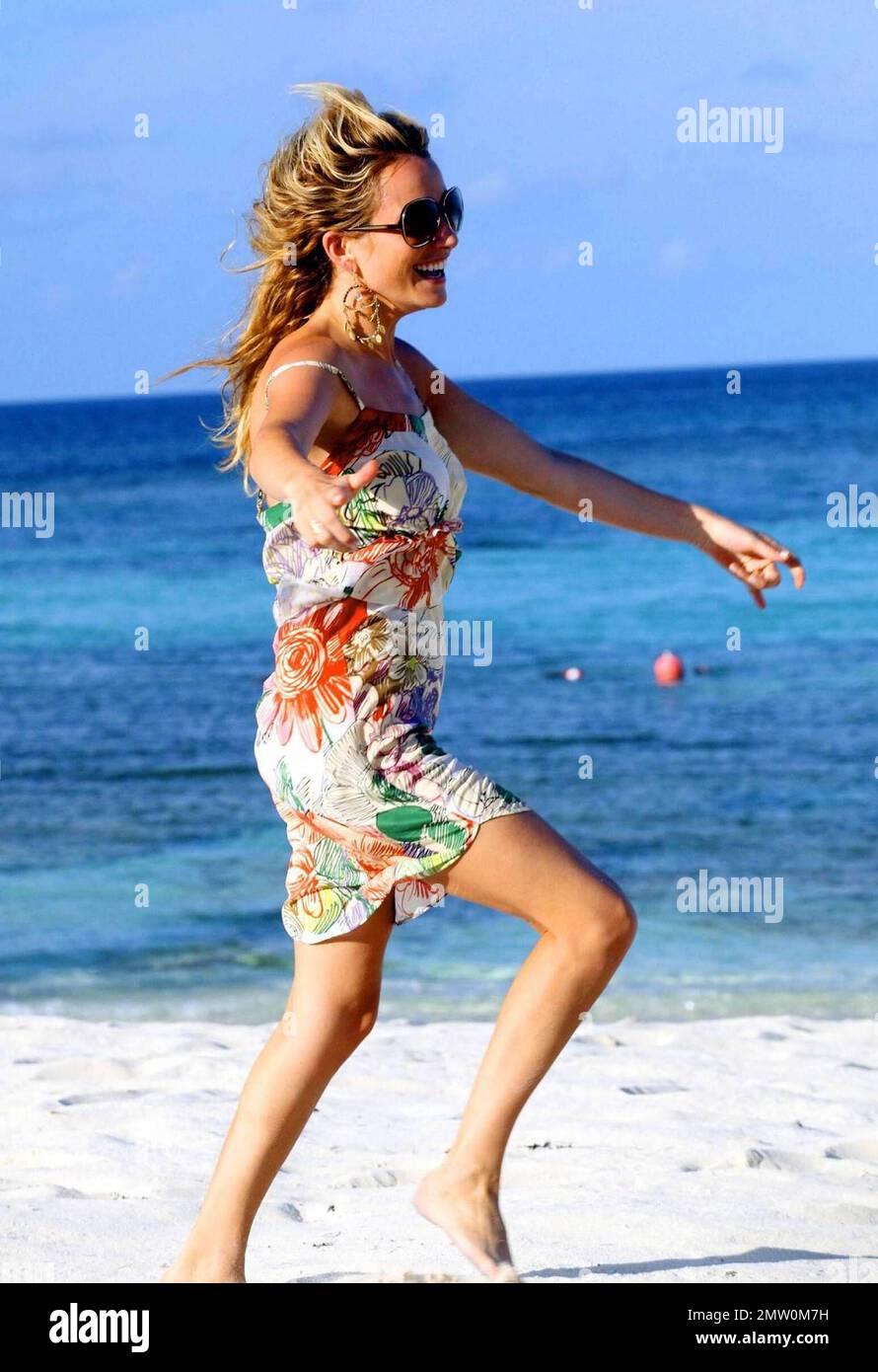 Becki Newton and Michael Urie lounge beachside and frolic on the beach ...