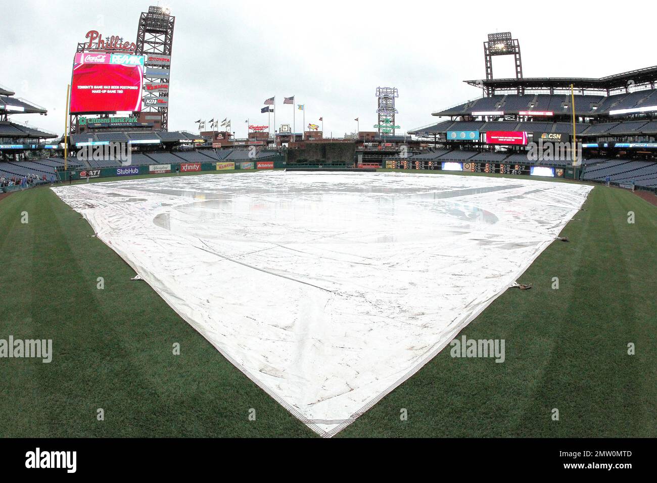 The tarp covers the infield of Citizens Bank Park where the ...