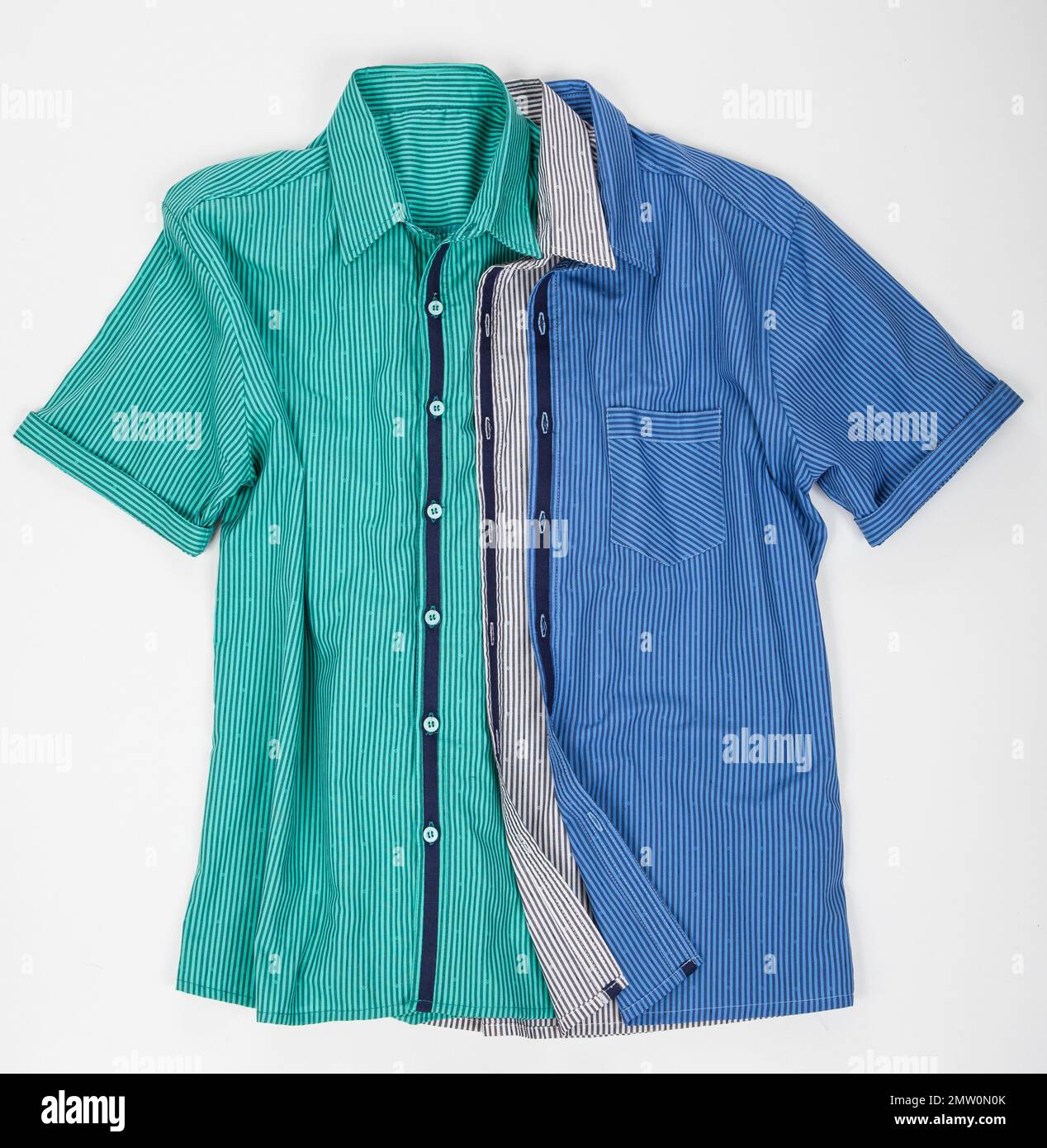 Set Of Three Men Shirts In White Background Stock Photo - Alamy