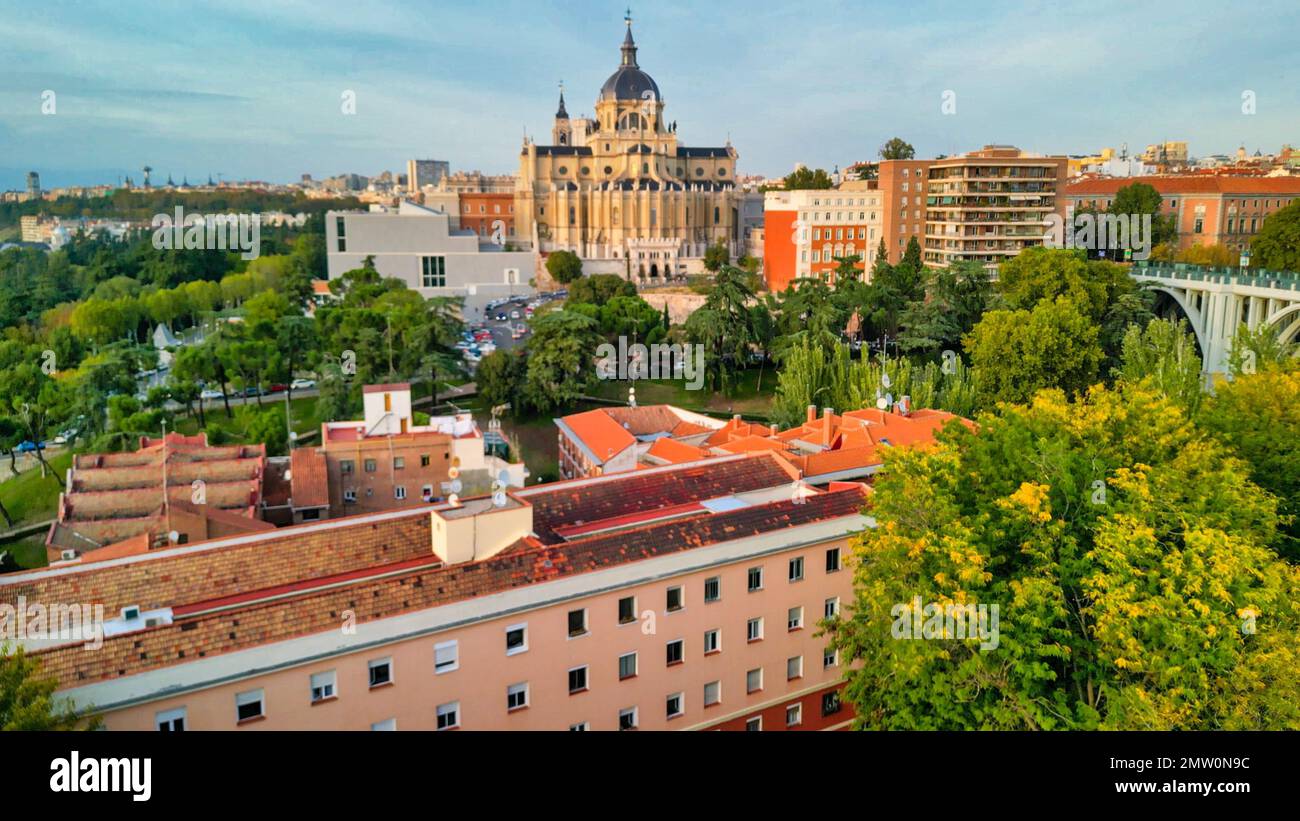 The view of Almudena Cathedral with other buildings in Madrid, Spain ...