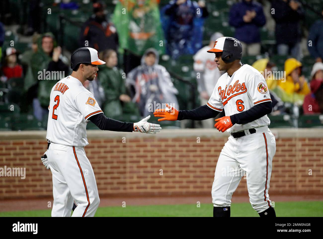Baltimore Orioles' Jonathan Schoop, right, high-fives teammate J.J ...