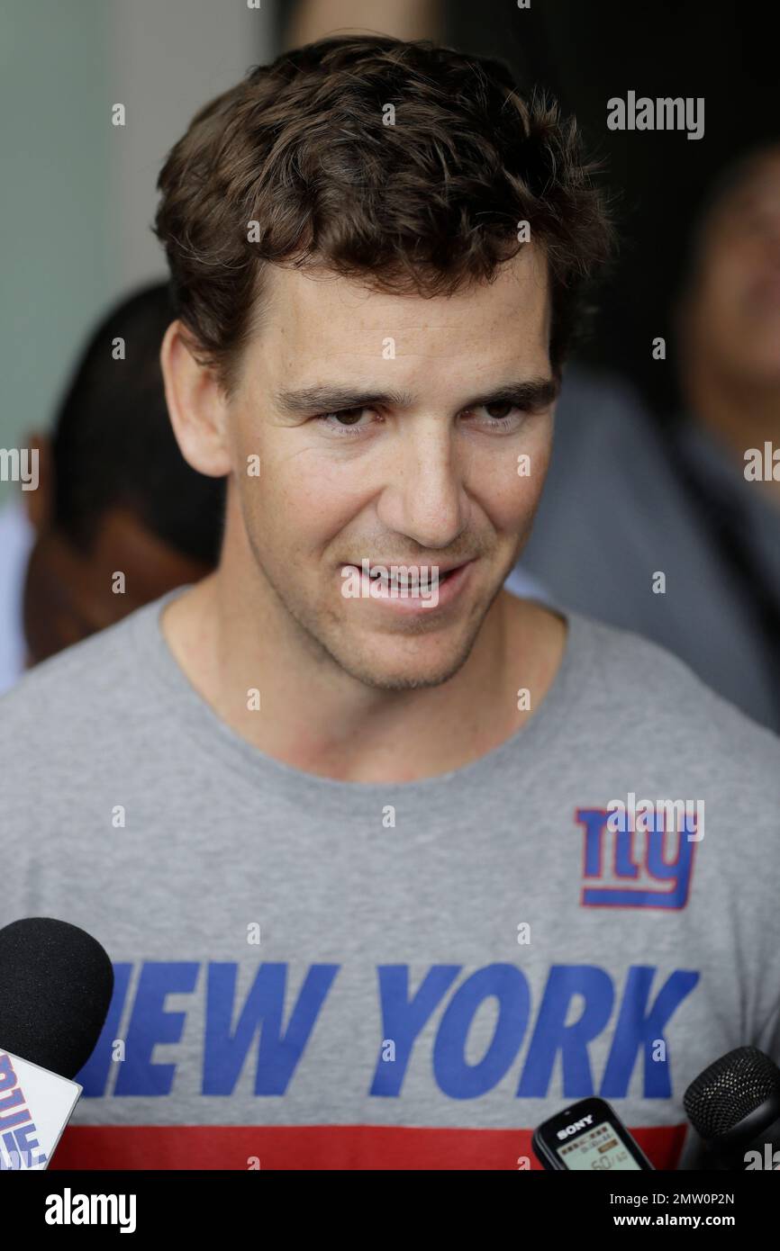New York Giants quarterback Eli Manning talks to reporters during ...