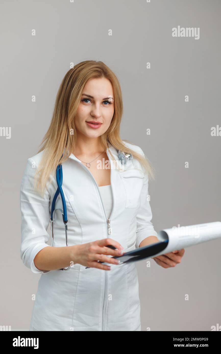 Young European Female Doctor Portrait with stethoscope and folder ...