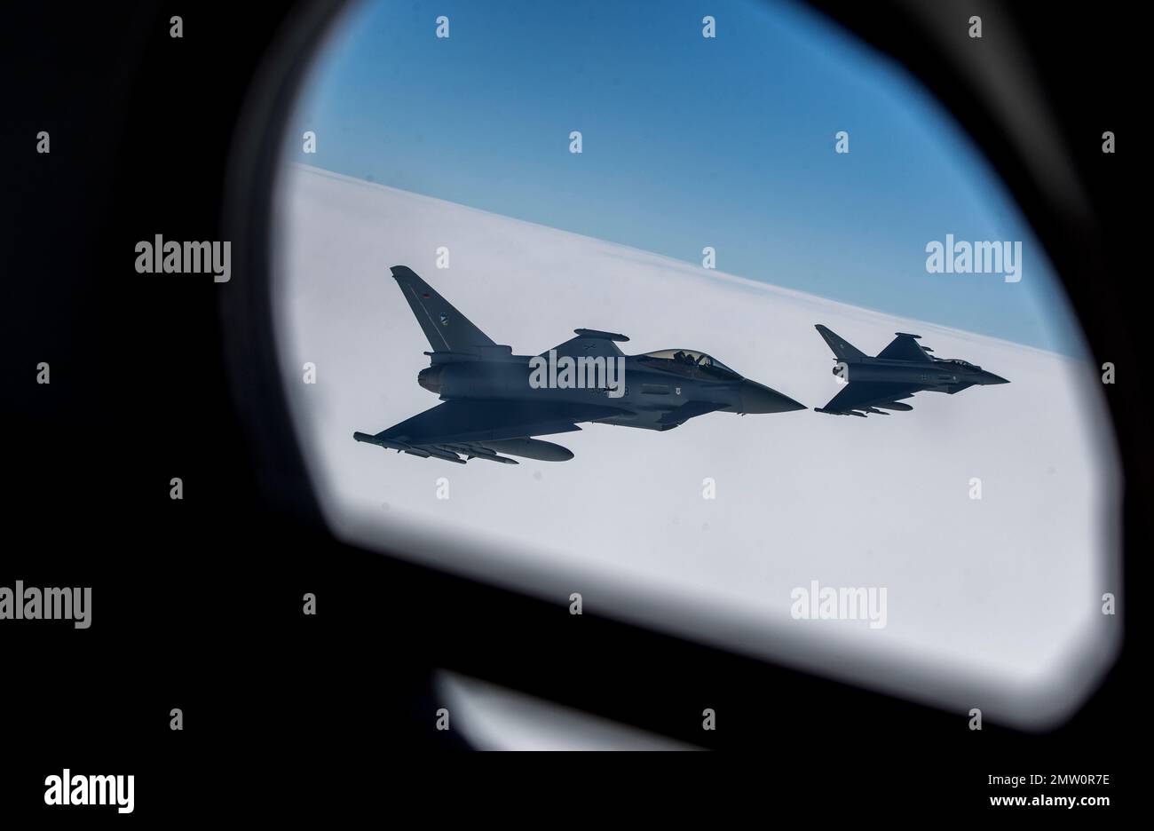 Seen through the window of another aircraft, an German Eurofighter ...