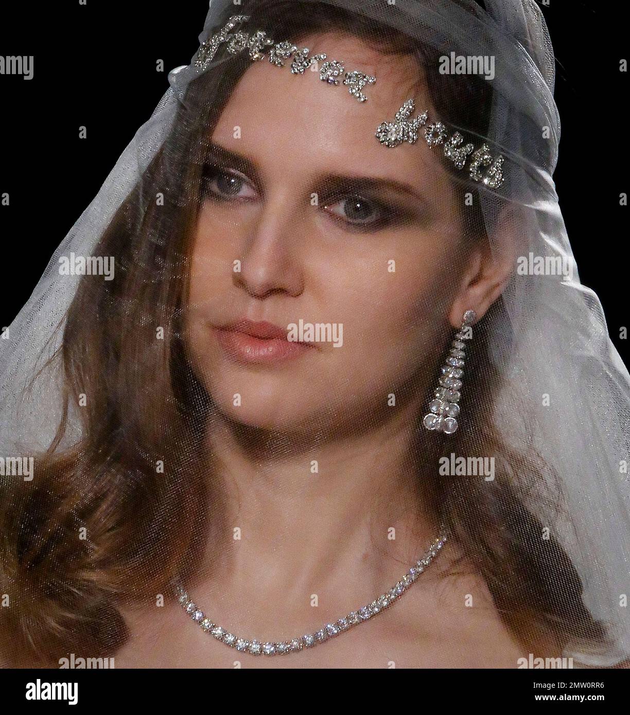 In this April 18, 2017 photo, a model wears bridal fashion from the ...