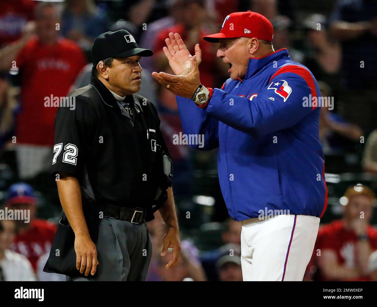 Home plate umpire Alfonso Marquez, listens as Texas Rangers manager ...
