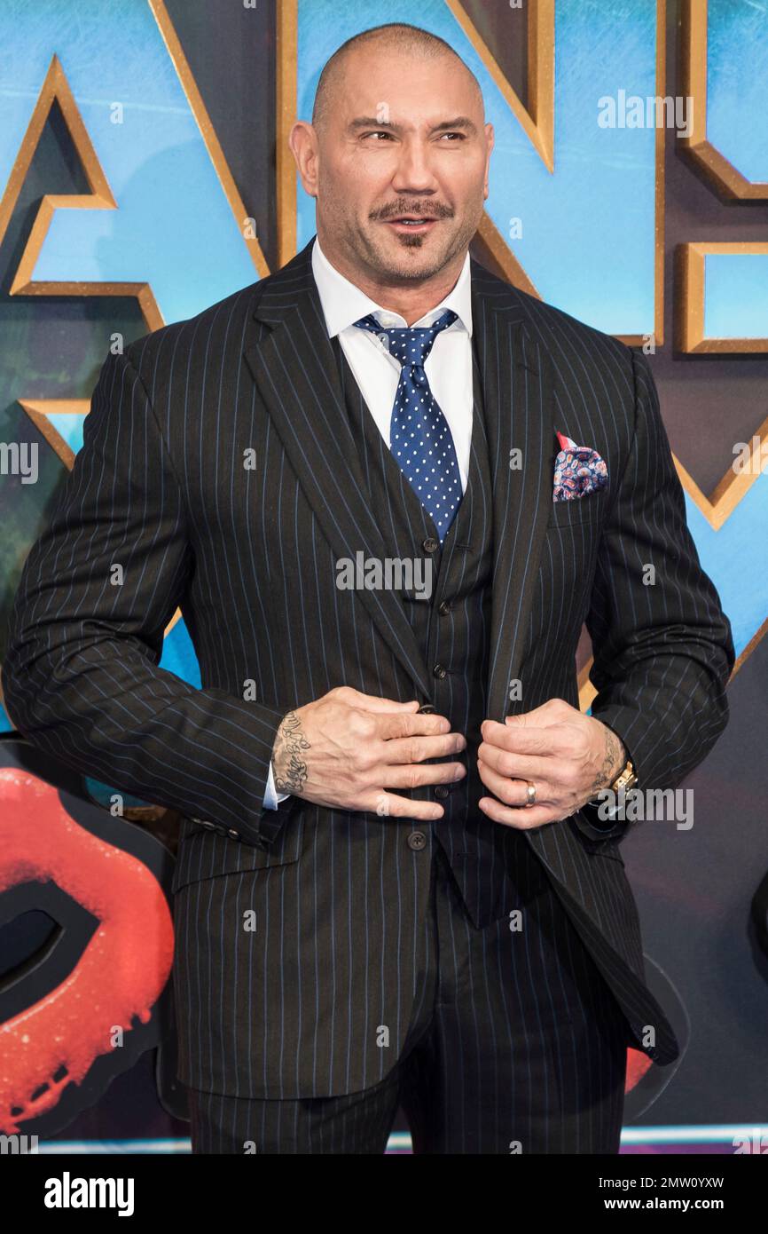 Actor Dave Bautista poses for photographers upon arrival at the ...
