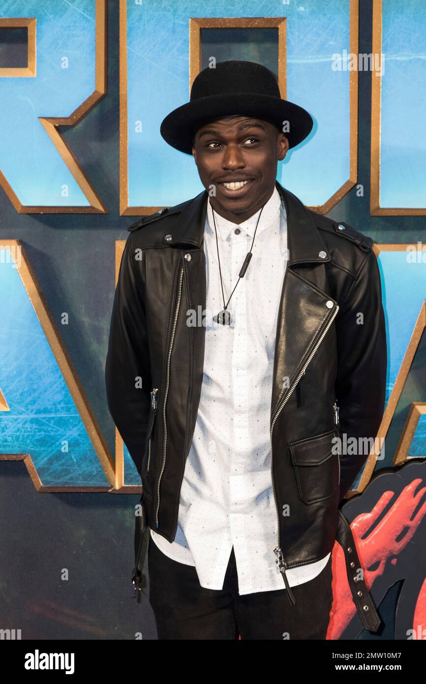 Mo Adeniran poses for photographers upon arrival at the premiere of the ...