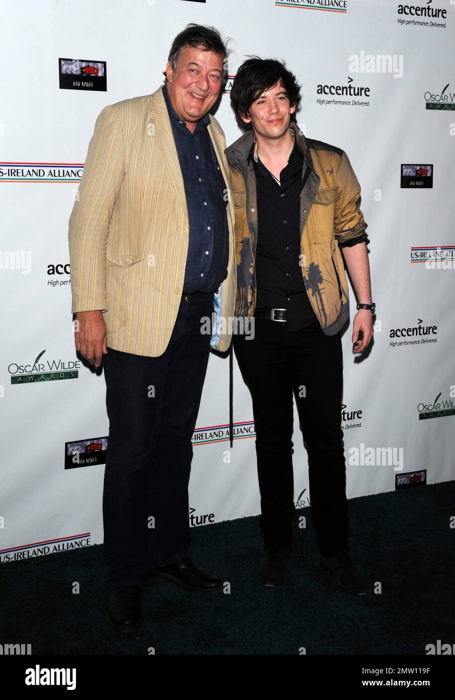 Stephen Fry and Elliott Spencer attend a Pre-Oscar event by the US ...