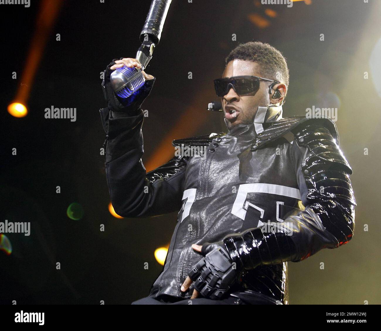 With sweat pouring from his face and clad in a buckle-detailed vest ...