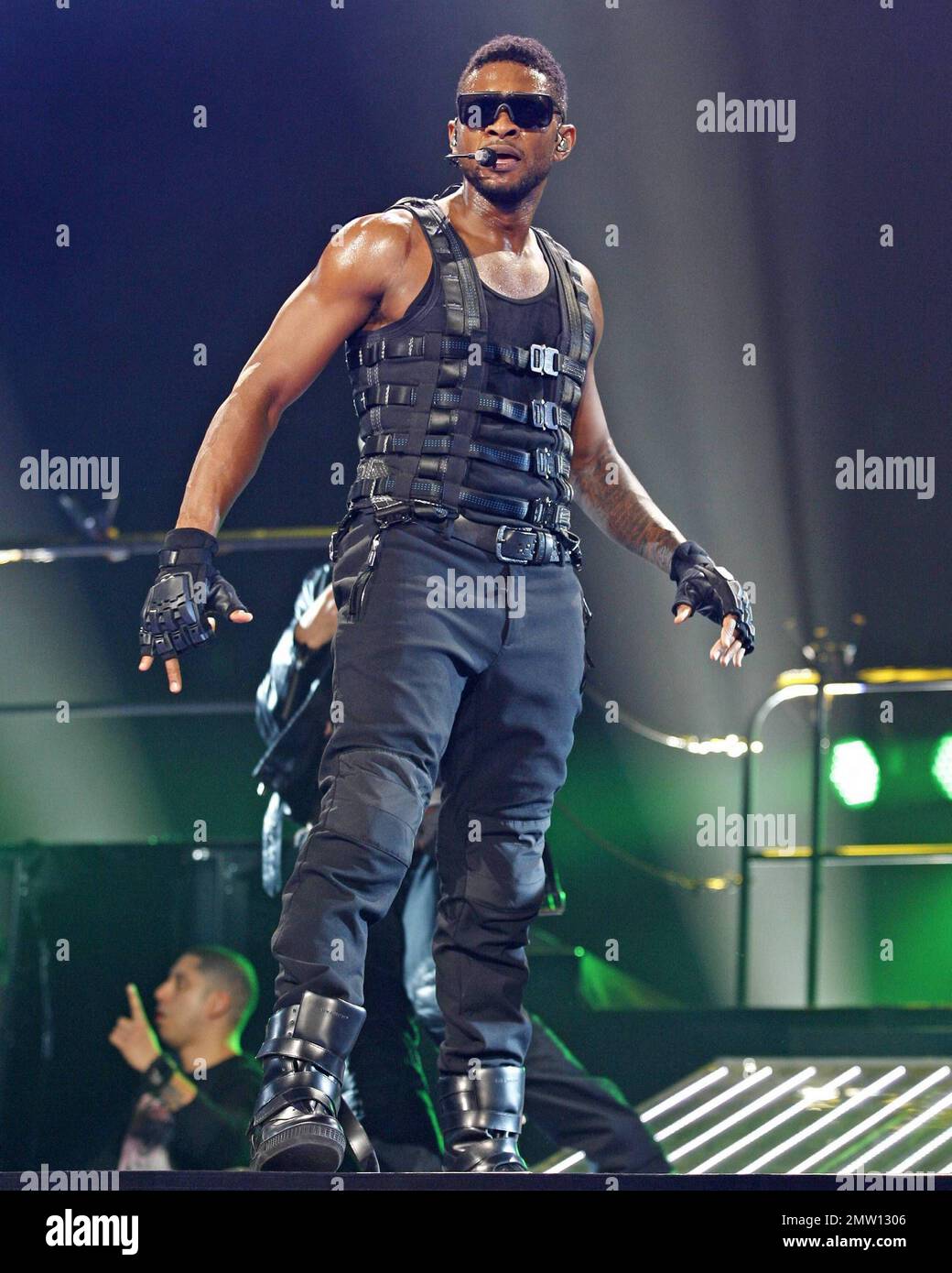 With sweat pouring from his face and clad in a buckle-detailed vest ...