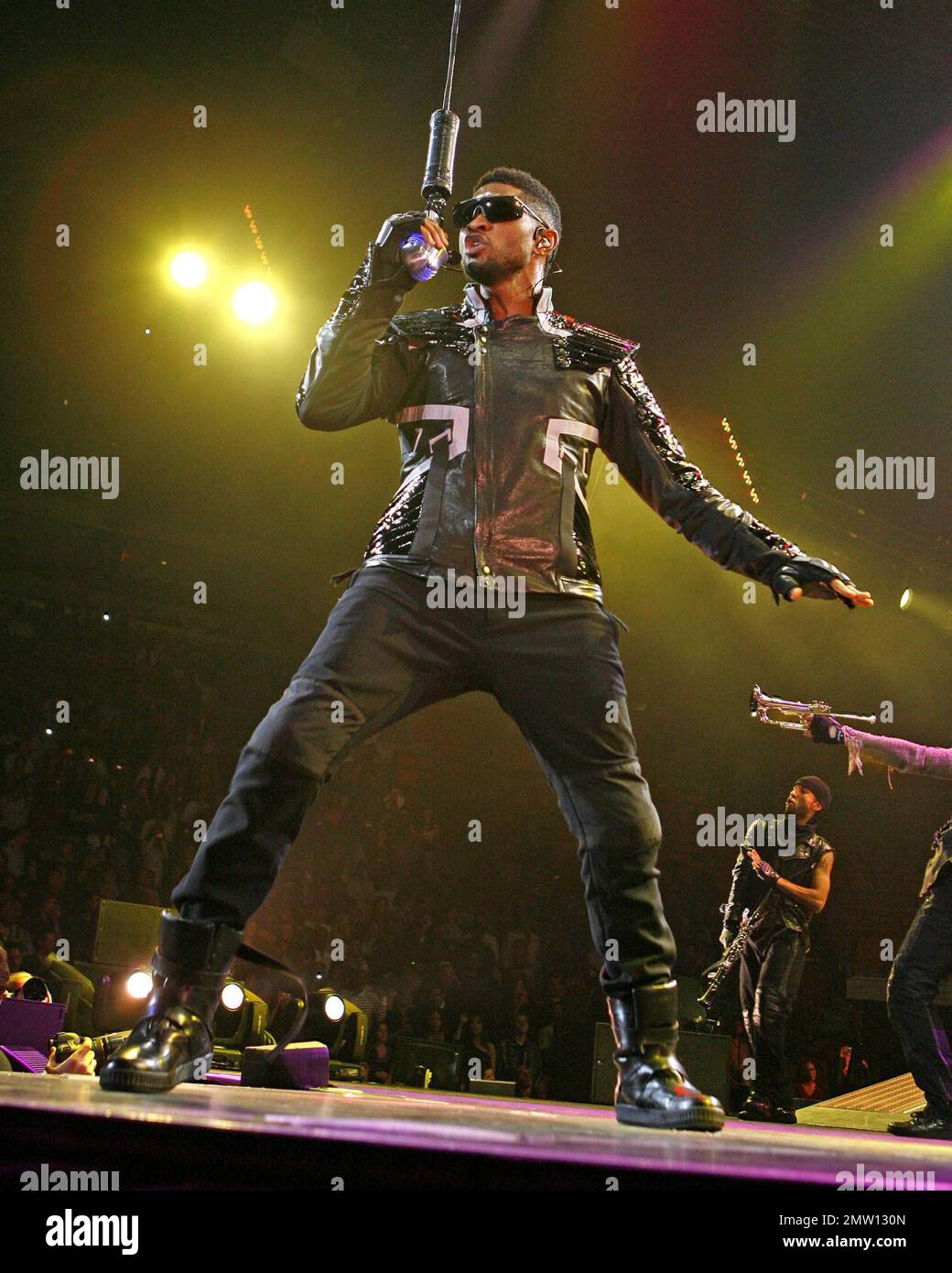 With sweat pouring from his face and clad in a buckle-detailed vest ...