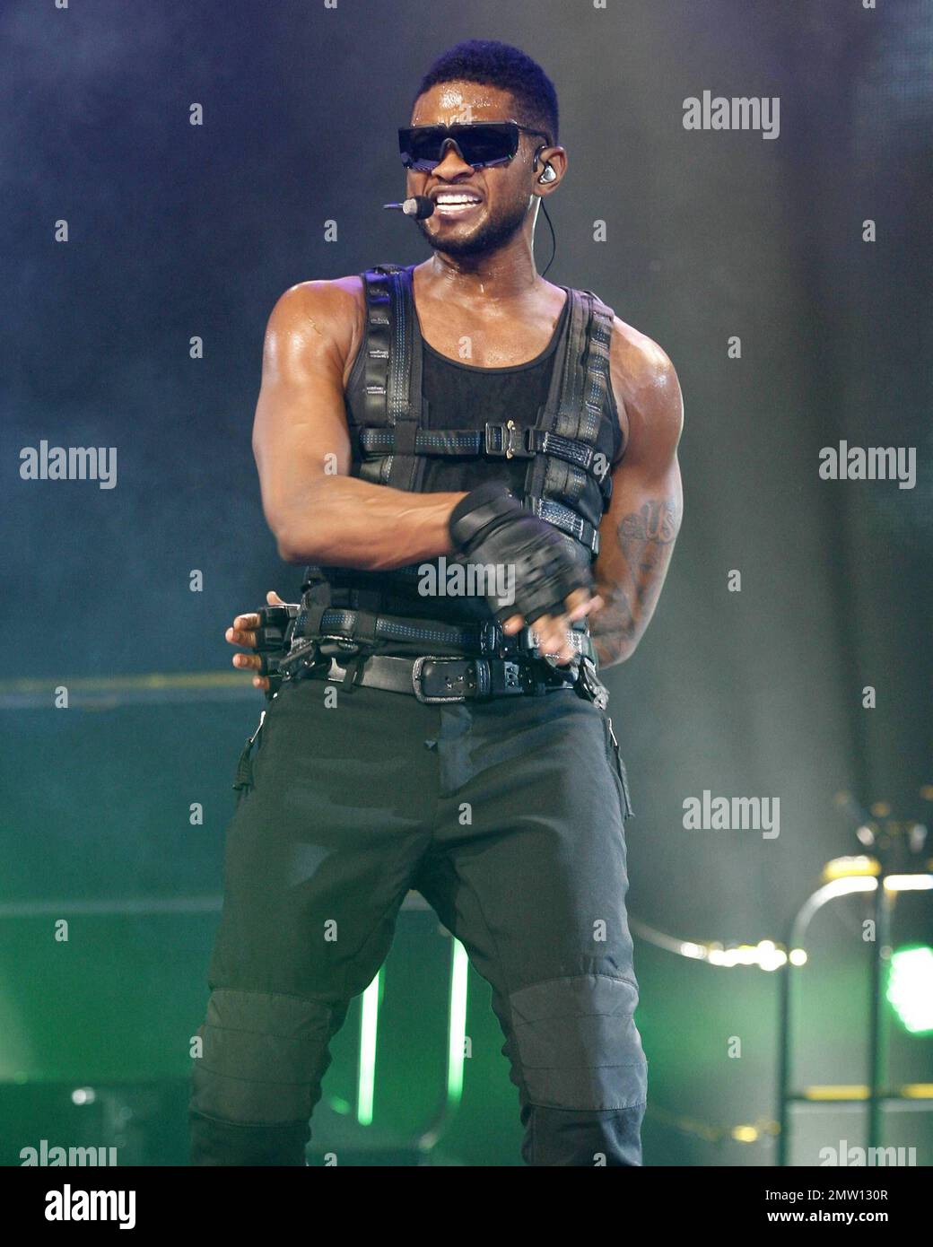 With sweat pouring from his face and clad in a buckle-detailed vest ...