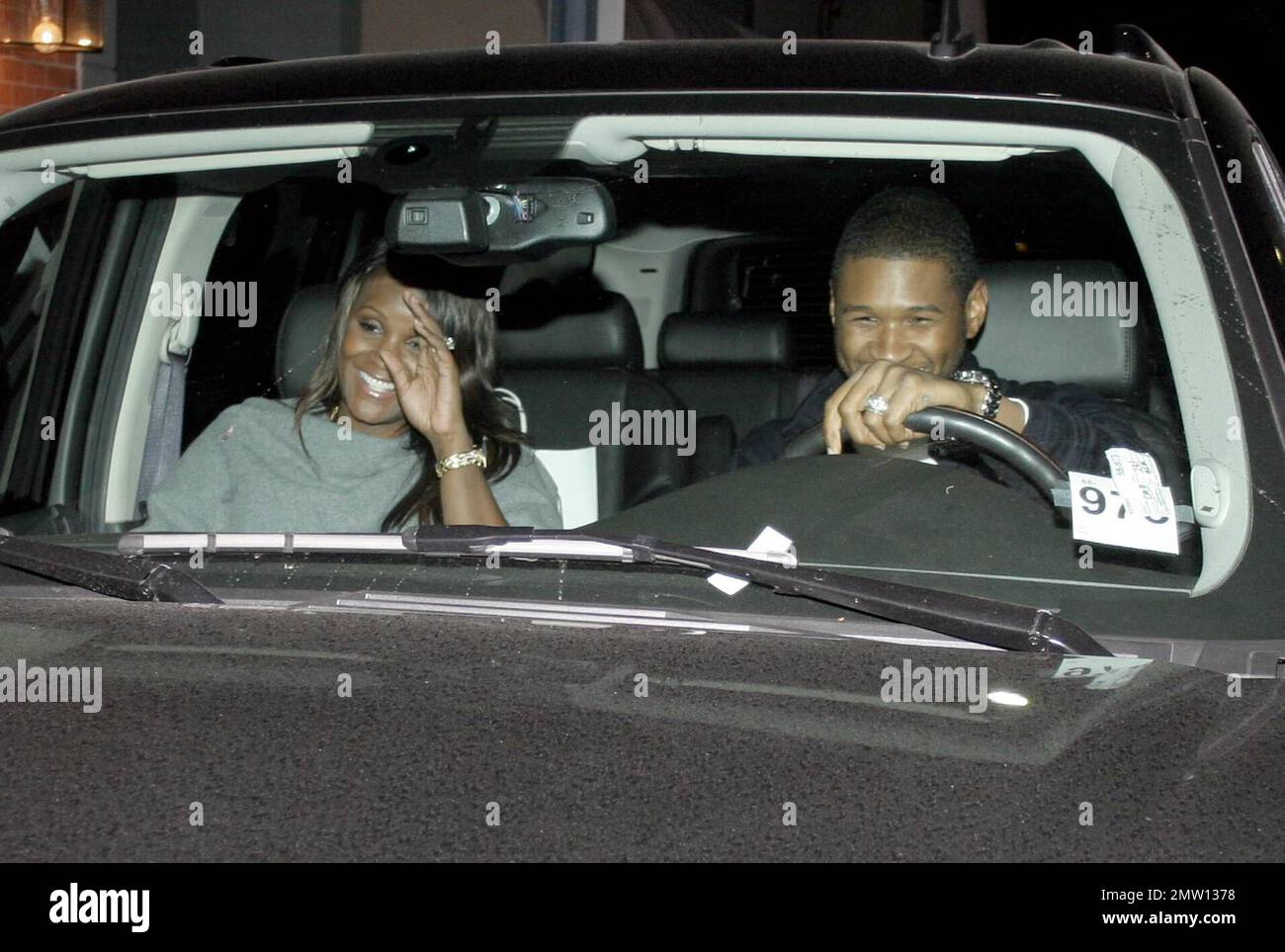 Usher and his wife Tameka Foster are all smiles as they leave the ...