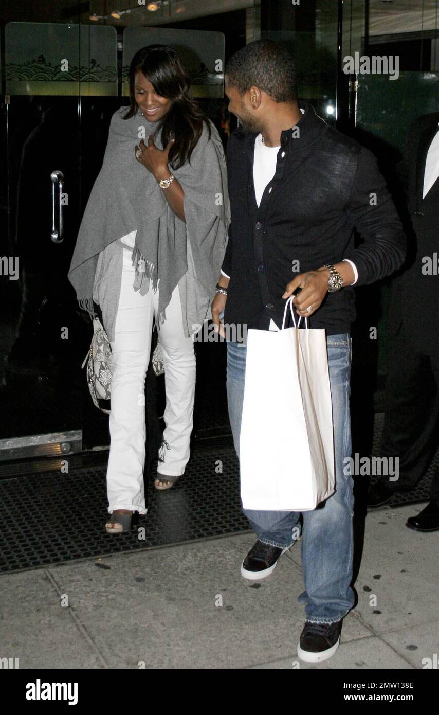 Usher and his wife Tameka Foster are all smiles as they leave the ...