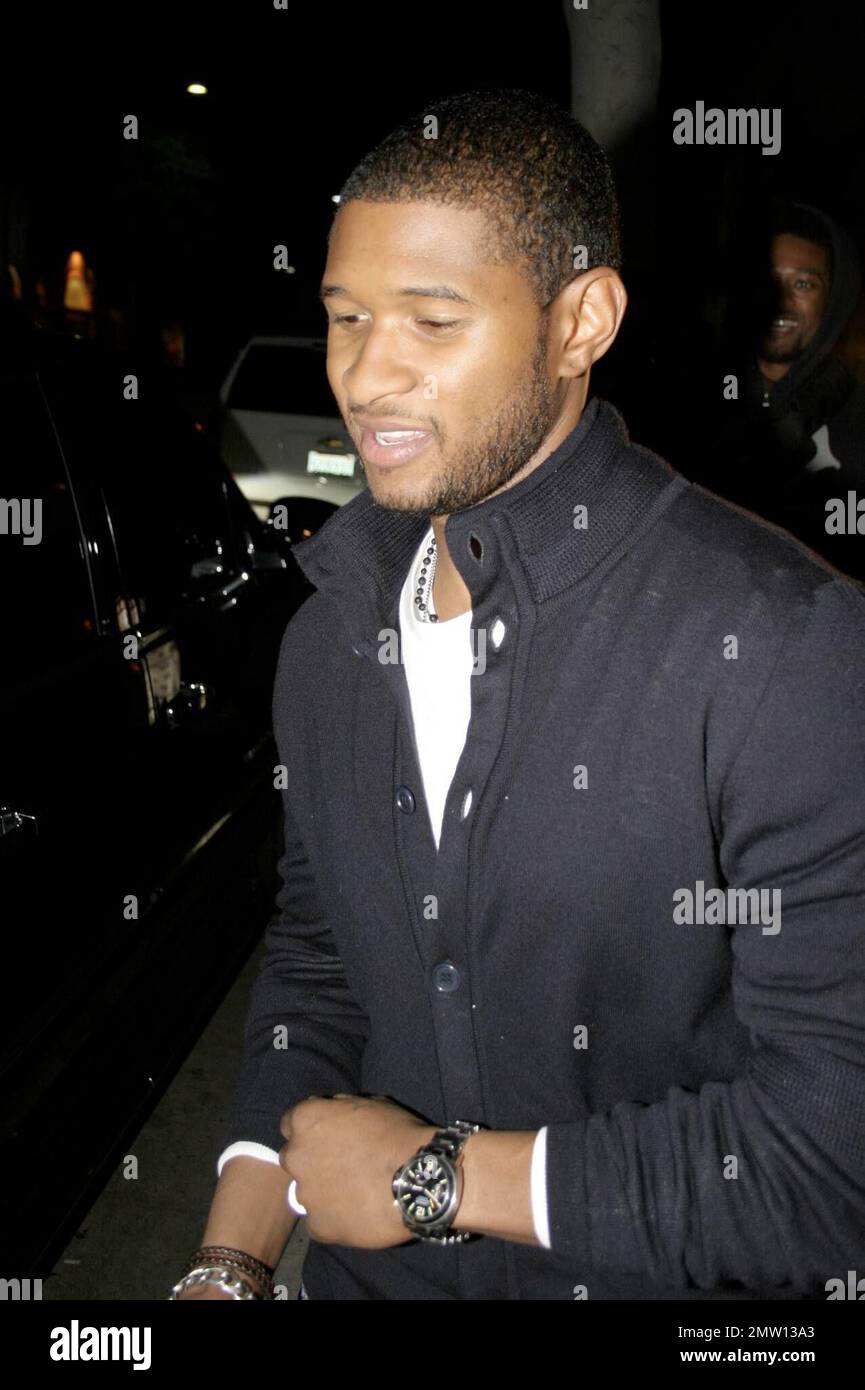 Usher and his wife Tameka Foster are all smiles as they leave the ...