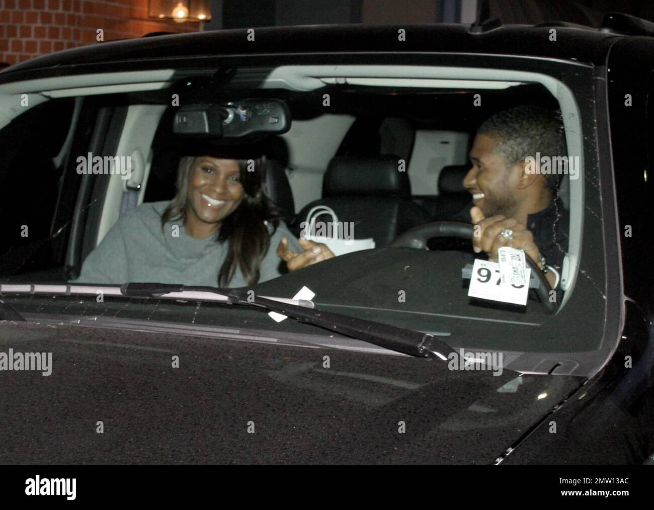 Usher and his wife Tameka Foster are all smiles as they leave the ...