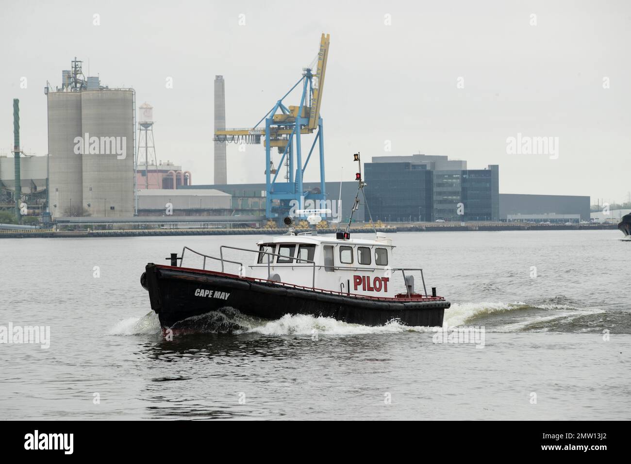 A pilot boat makes its way up the Delaware River in Philadelphia ...