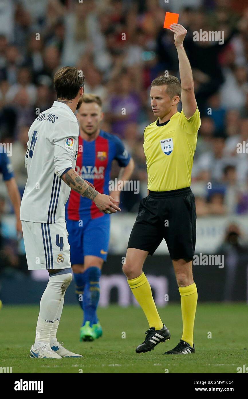 Real Madrid's Sergio Ramos is shown the red card by the referee after ...