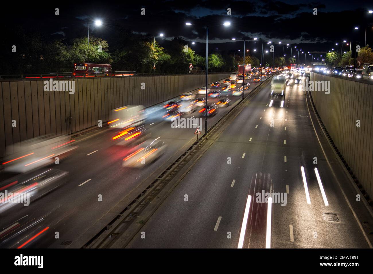Light trails from fast moving traffic on the A40 at Perivale in London ...