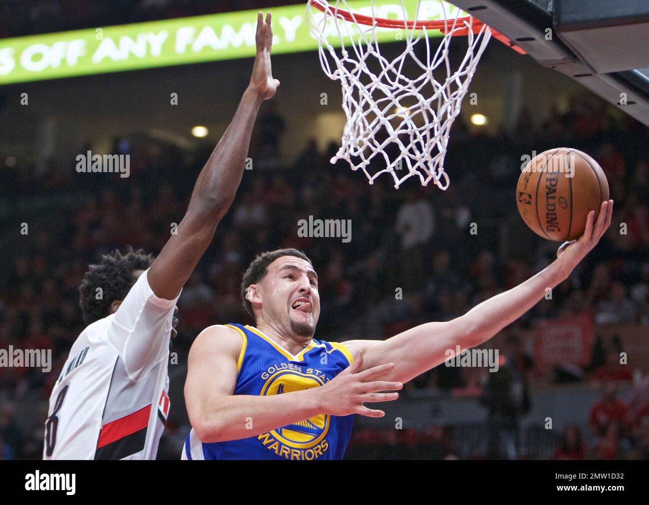 Golden State Warriors guard Klay Thompson, right, shoots over Portland ...