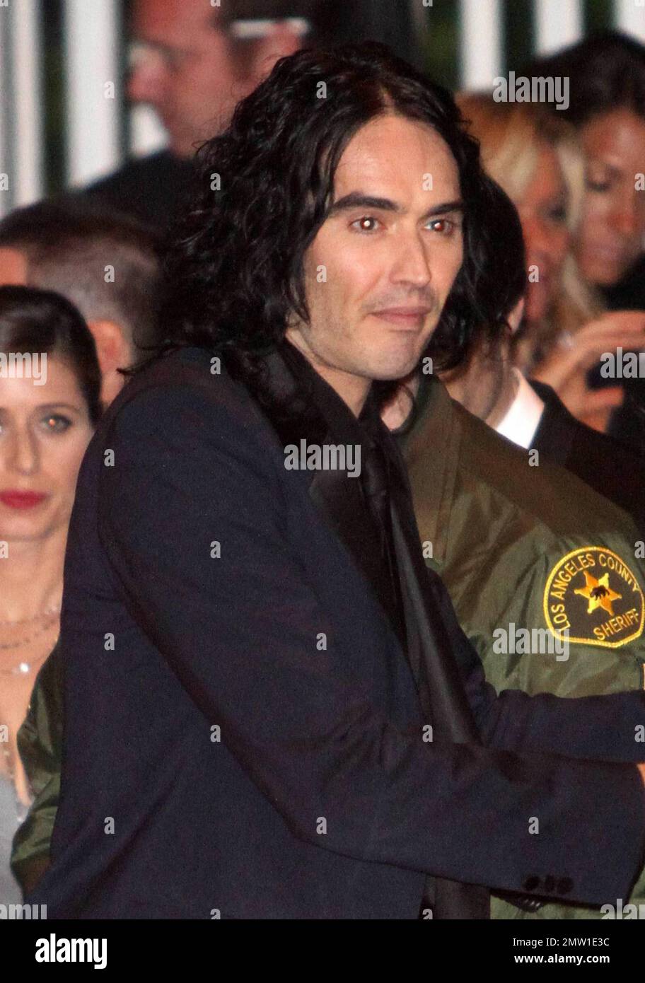 Comedian and actor Russell Brand arrives at the Vanity Fair Oscars ...