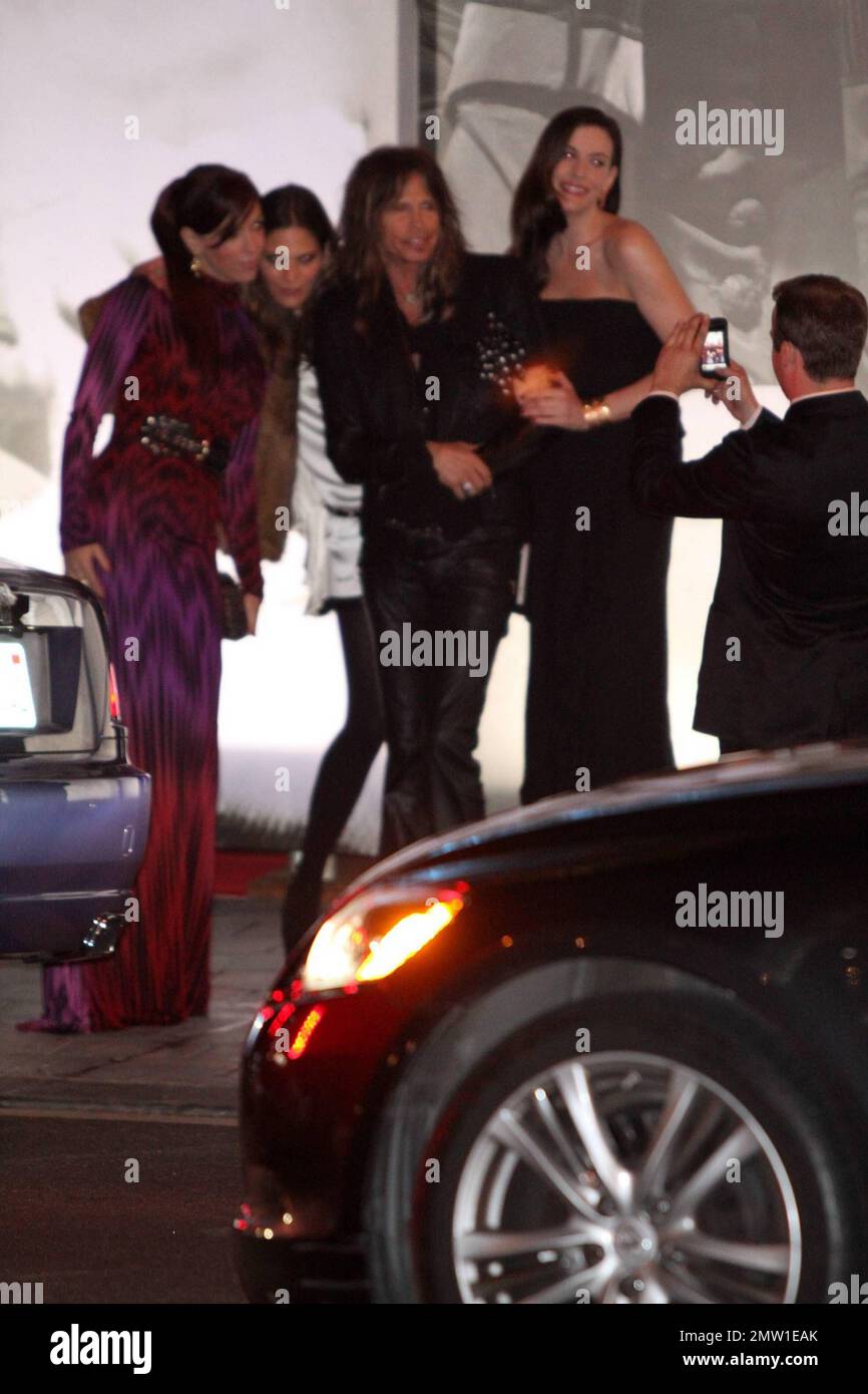 Musician Steven Tyler and girlfriend Erin Brady (L) pose for an ...