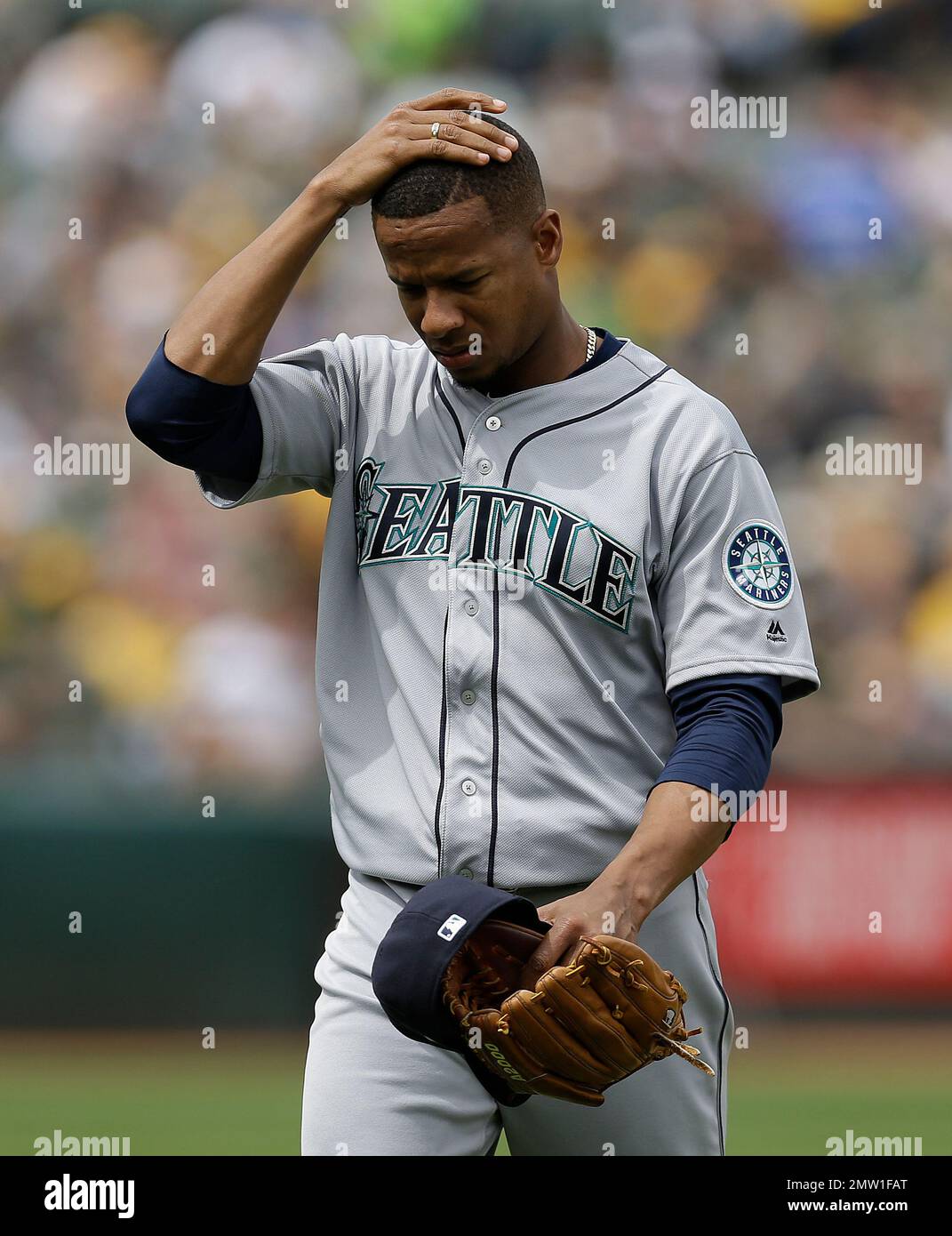 Seattle Mariners pitcher Ariel Miranda places his hand on his head ...