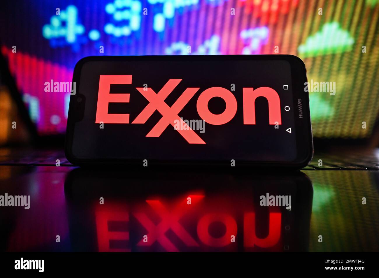 In this photo illustration, an Exxon logo is displayed on a smartphone ...