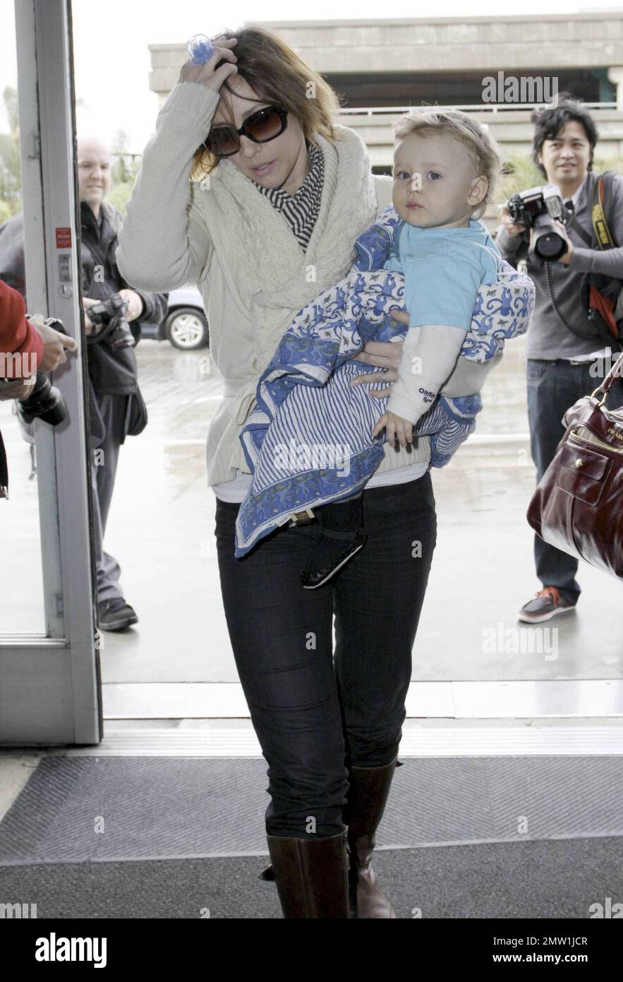 "Up in the Air" star Vera Farmiga carries her son Flynn as she arrives ...