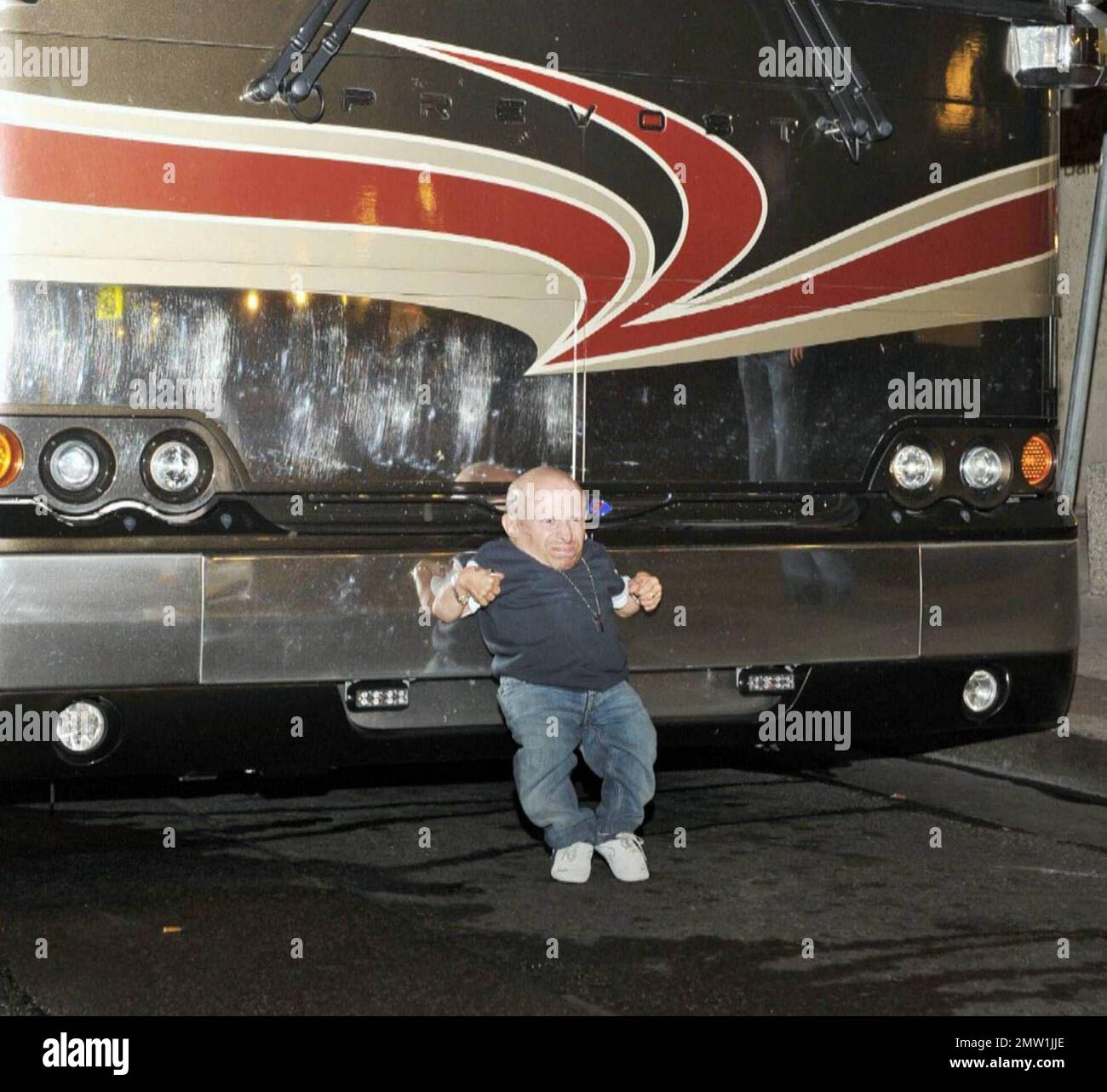 Verne Troyer shows off ride. The Mini Me actor posed with a tour bus ...
