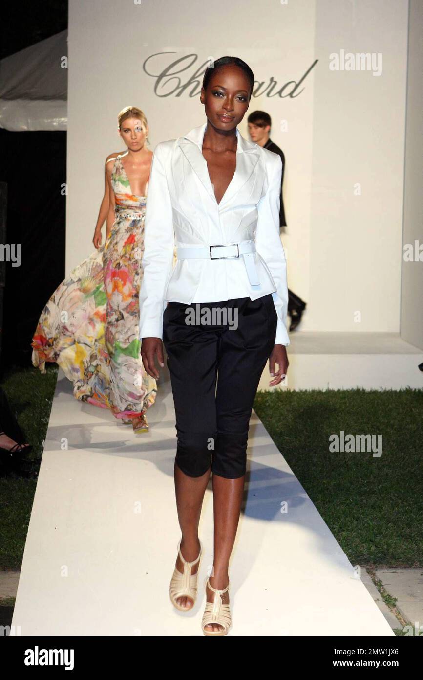 Models walk the runway during the Versace and Chopard Fashion Show at ...