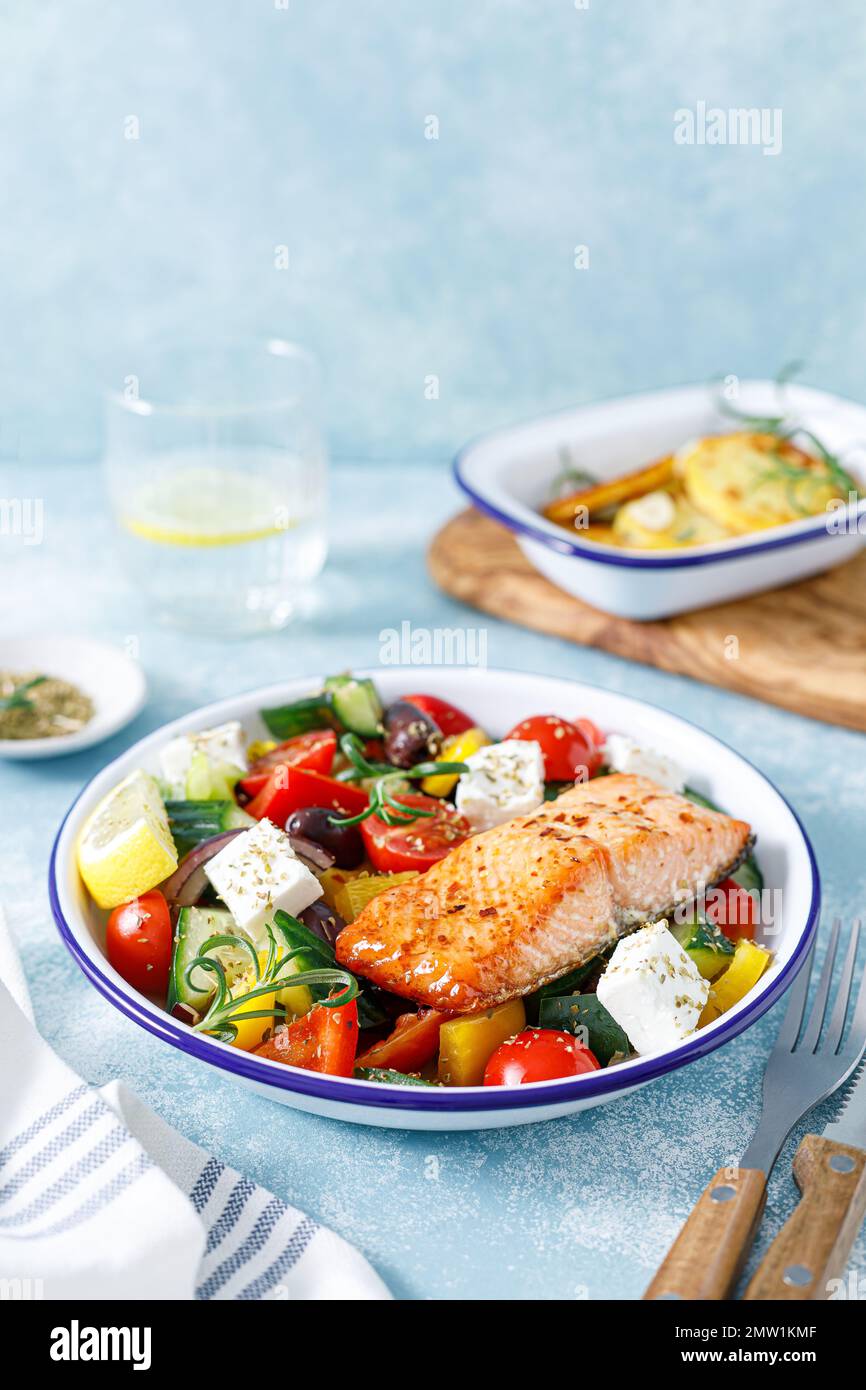 Greek salad with grilled salmon fish. Traditional mediterranean cuisine ...